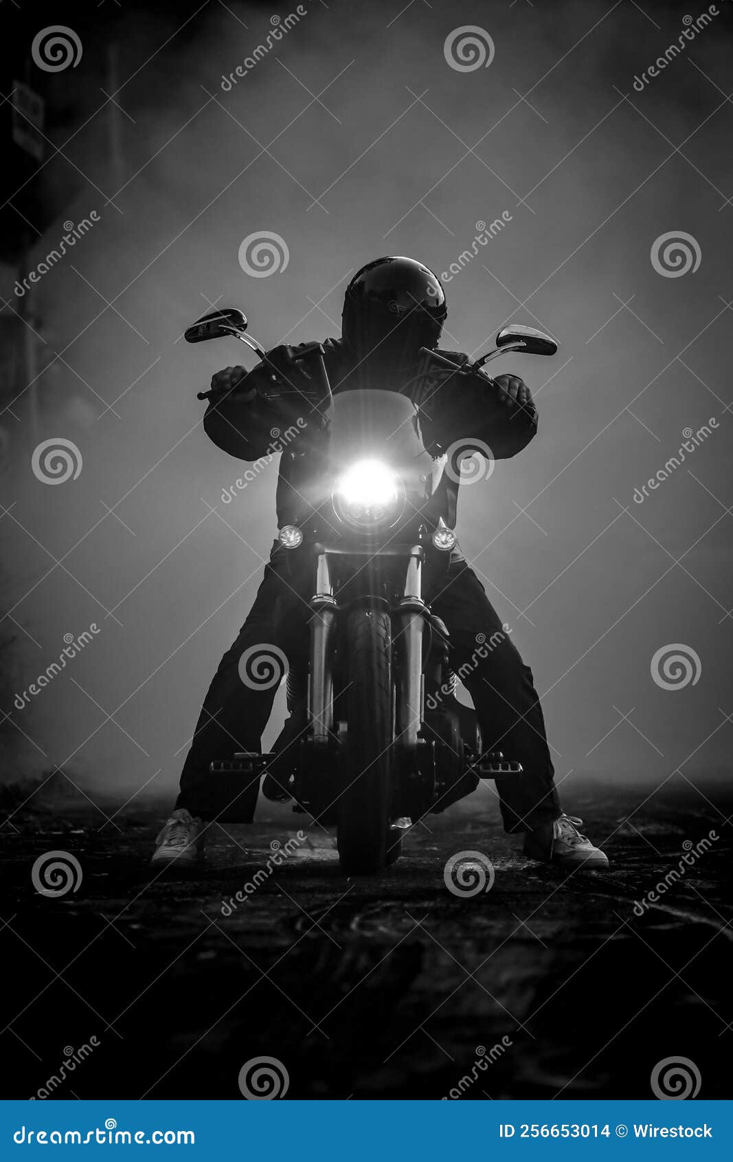 Grayscale Shot of Motorcycle Rider Facing the Camera with the Light on ...
