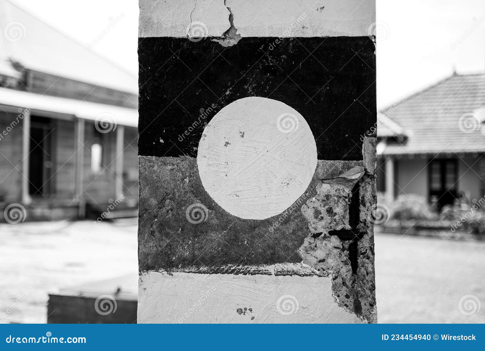 Grayscale Shot of the Old Column with a Painted Circle. Stock Photo ...