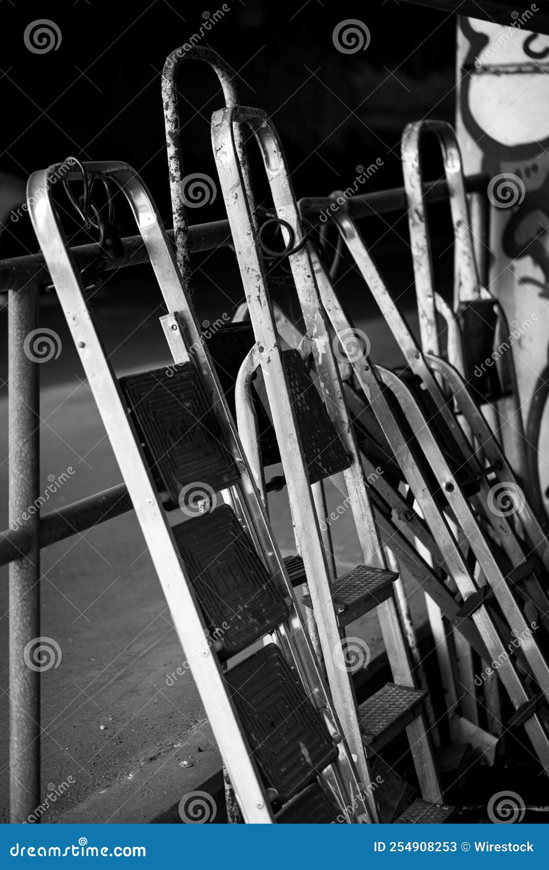 Metal Ladders Silhouette Against Tall Bright Glass Windows Going Up ...