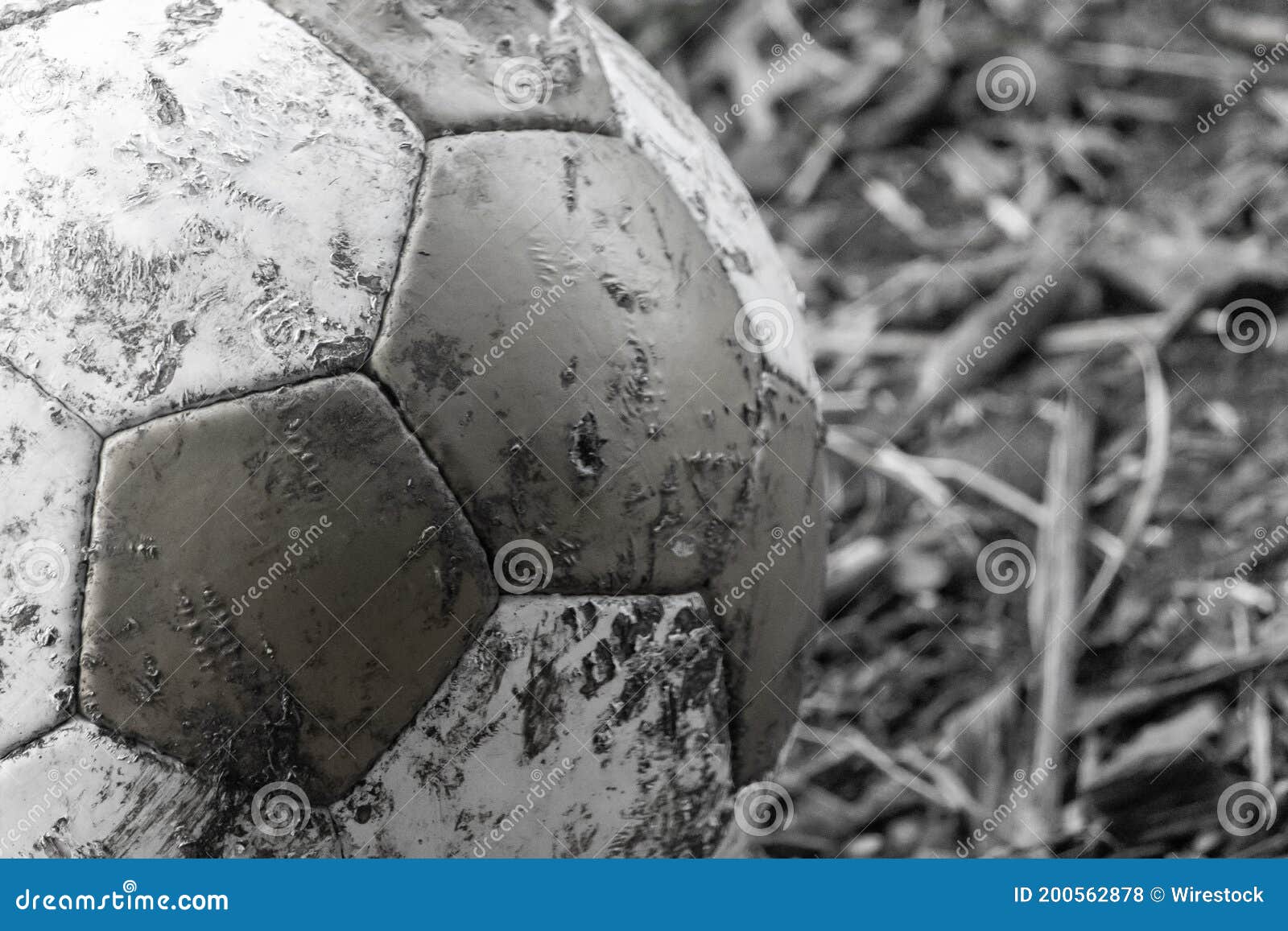 Grayscale Shot of an Old Soccer Ball on the Ground Stock Photo - Image ...