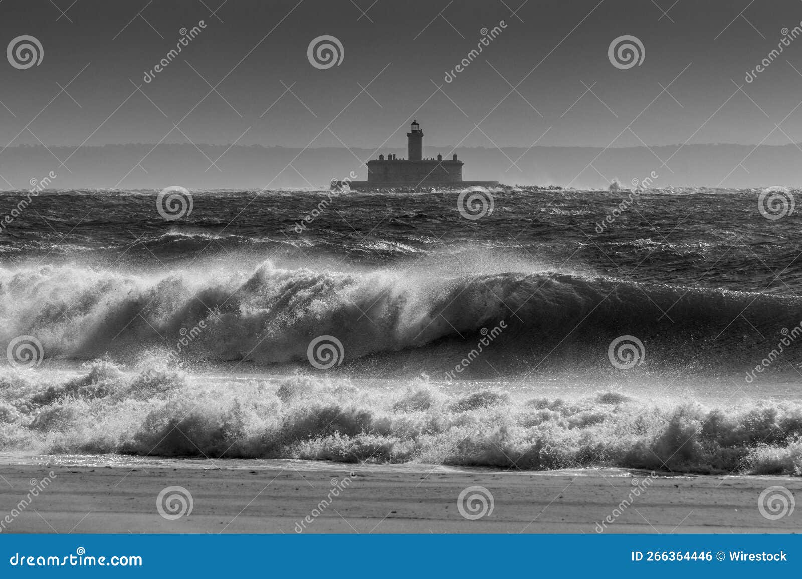 Grayscale Shot of the Strong Ocean Waves with a Lighthouse in the ...
