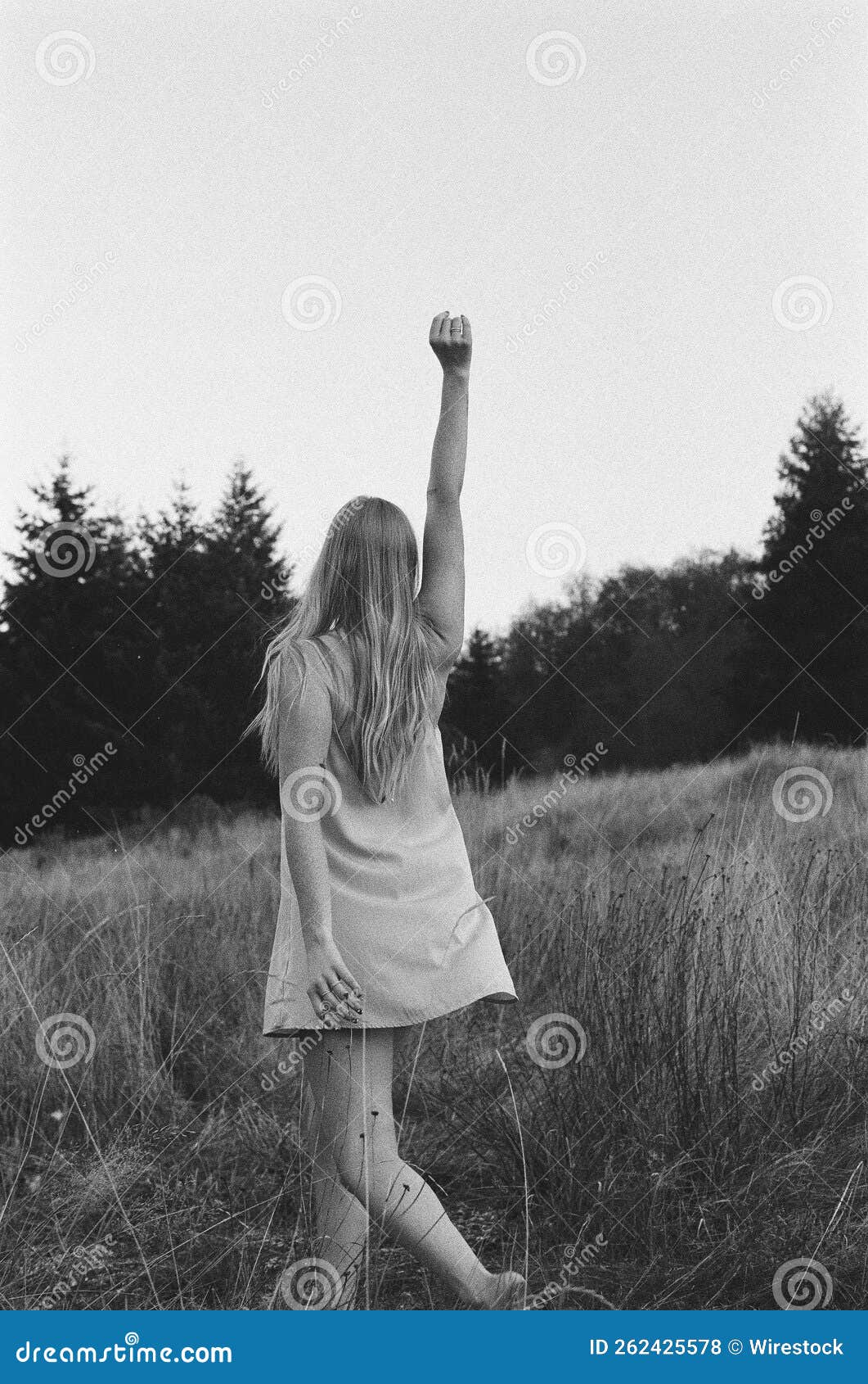Grayscale Shot of a Woman Dancing in the Field - Happy and Free Stock ...