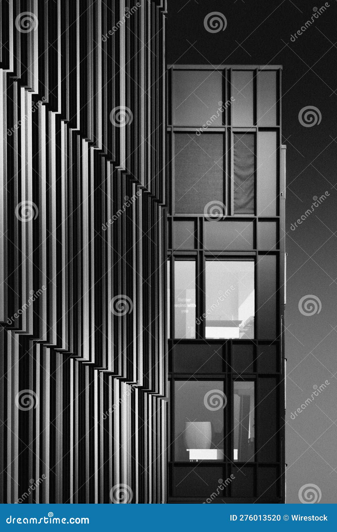 Grayscale of a Structure Featuring a Series of Windows with a Backdrop ...