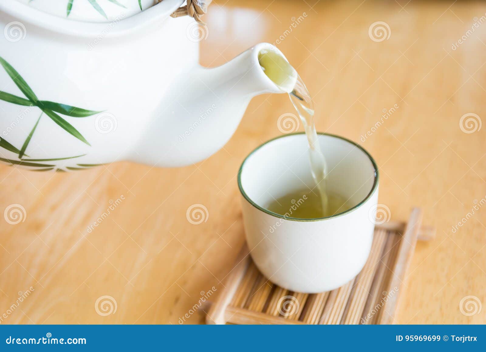 Grean Tea Flow from Tea Pot To a White Cup. Stock Image - Image of ...