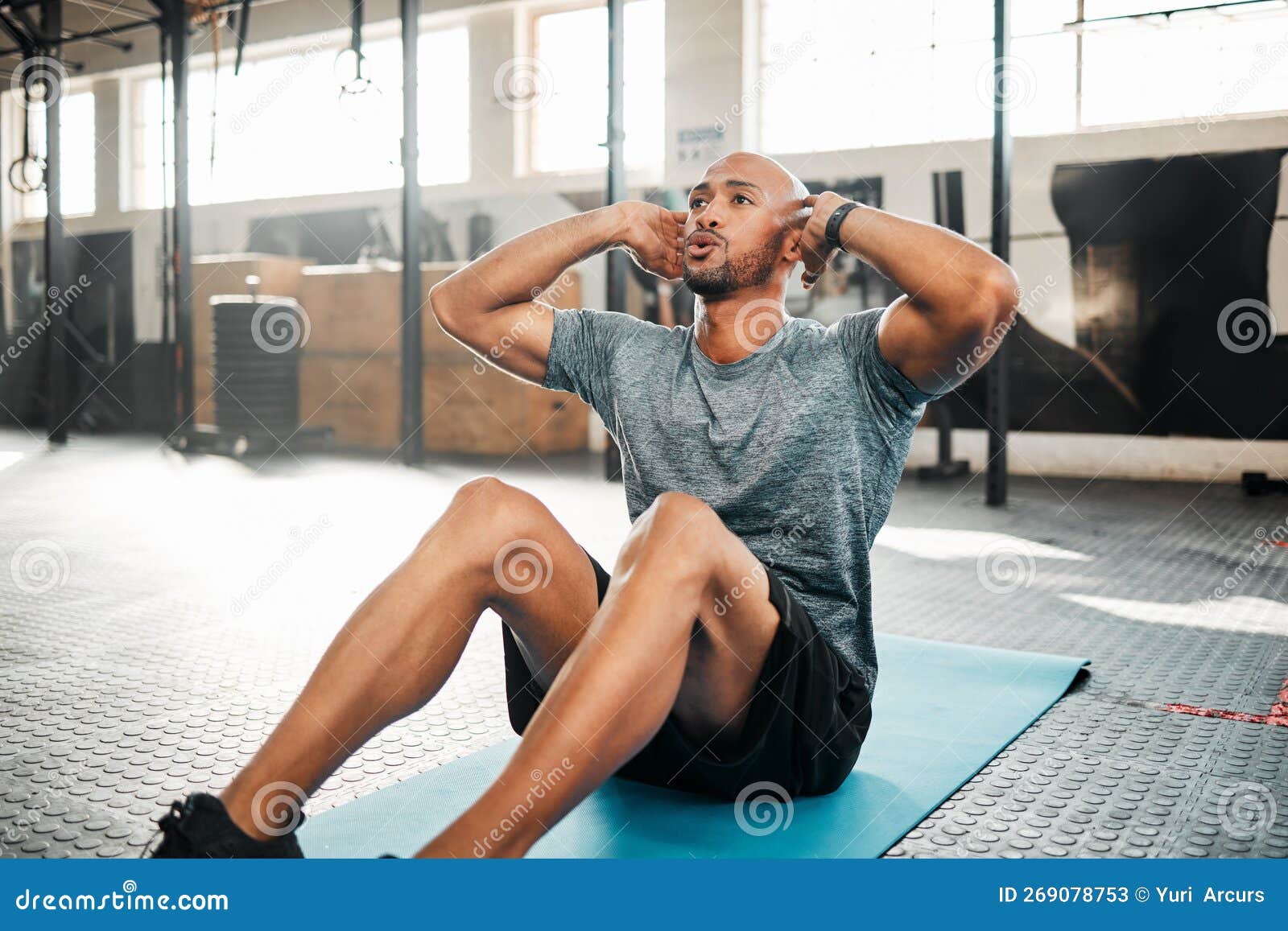 Great Posture Comes from a Strong Core. a Young Man Completing Crunches ...
