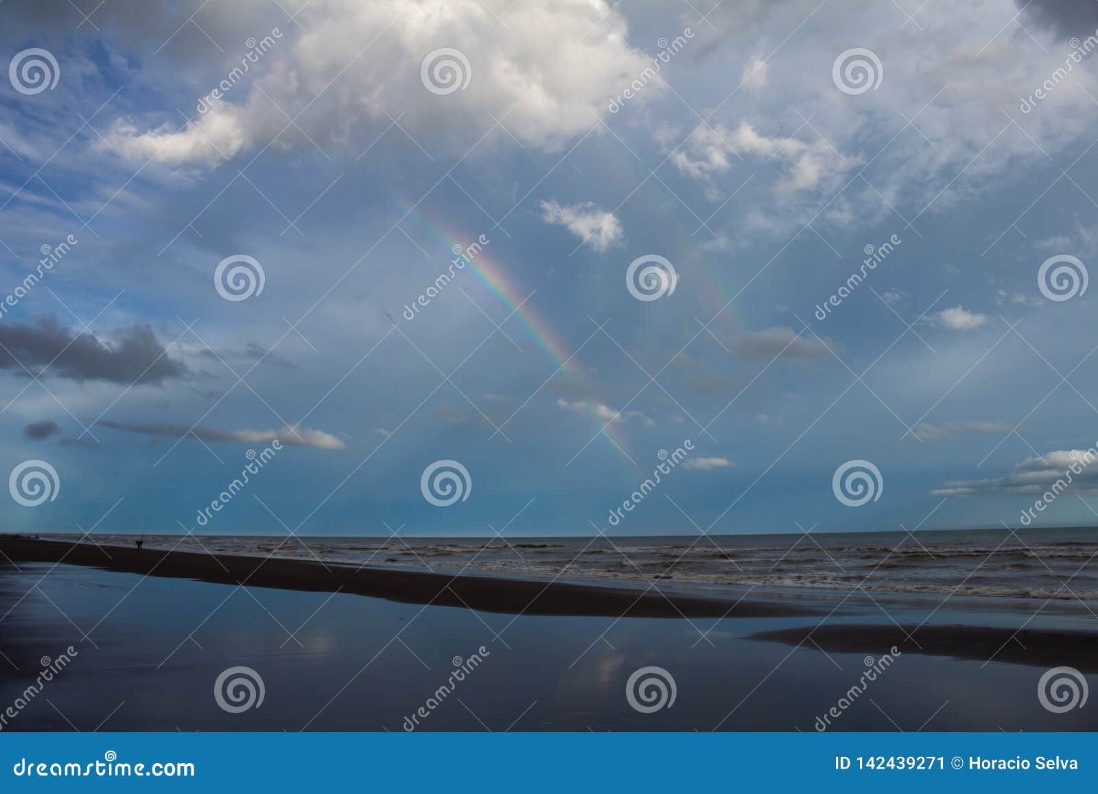 Great Rainbow on the Edge of the Sea. the Light is Broken by the Action ...