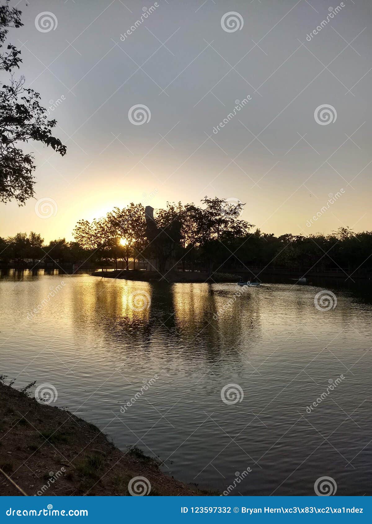 Sunset on lake stock photo. Image of puesta, sunset - 123597332