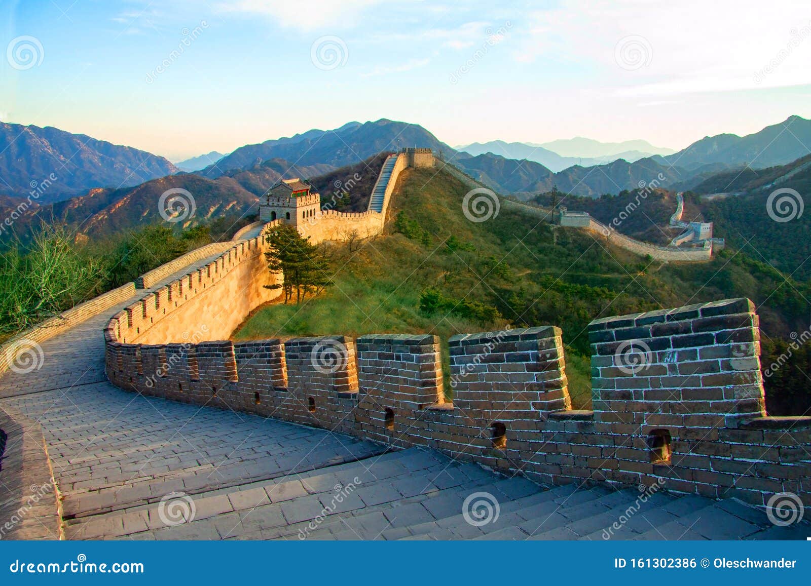 The Great Wall of China with Distant Mountains and Blue Sky Stock Photo ...
