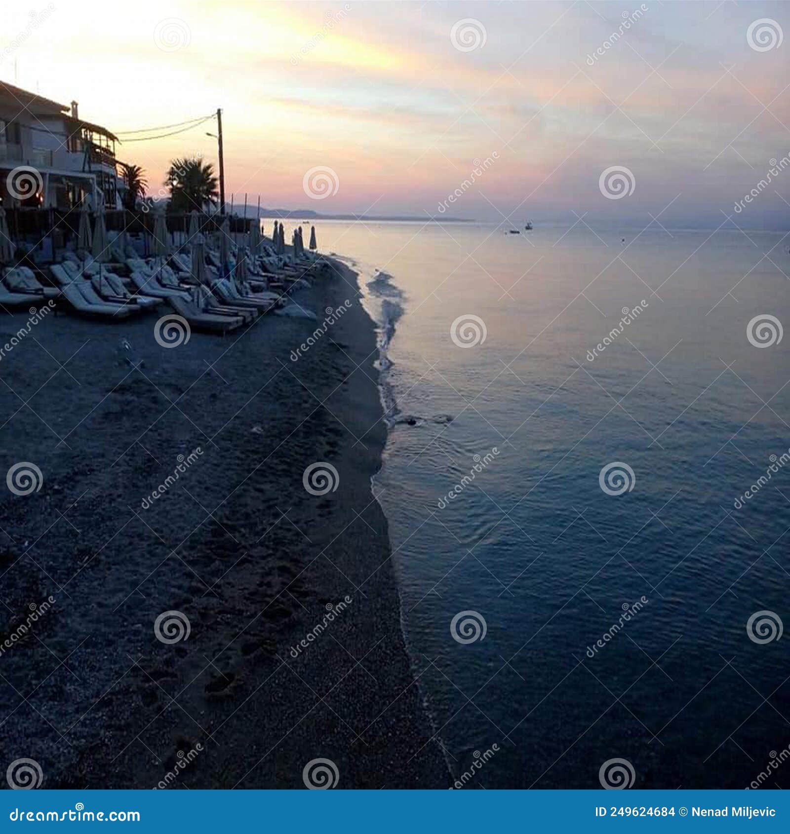 Greece beach sunset... stock photo. Image of sunset - 249624684