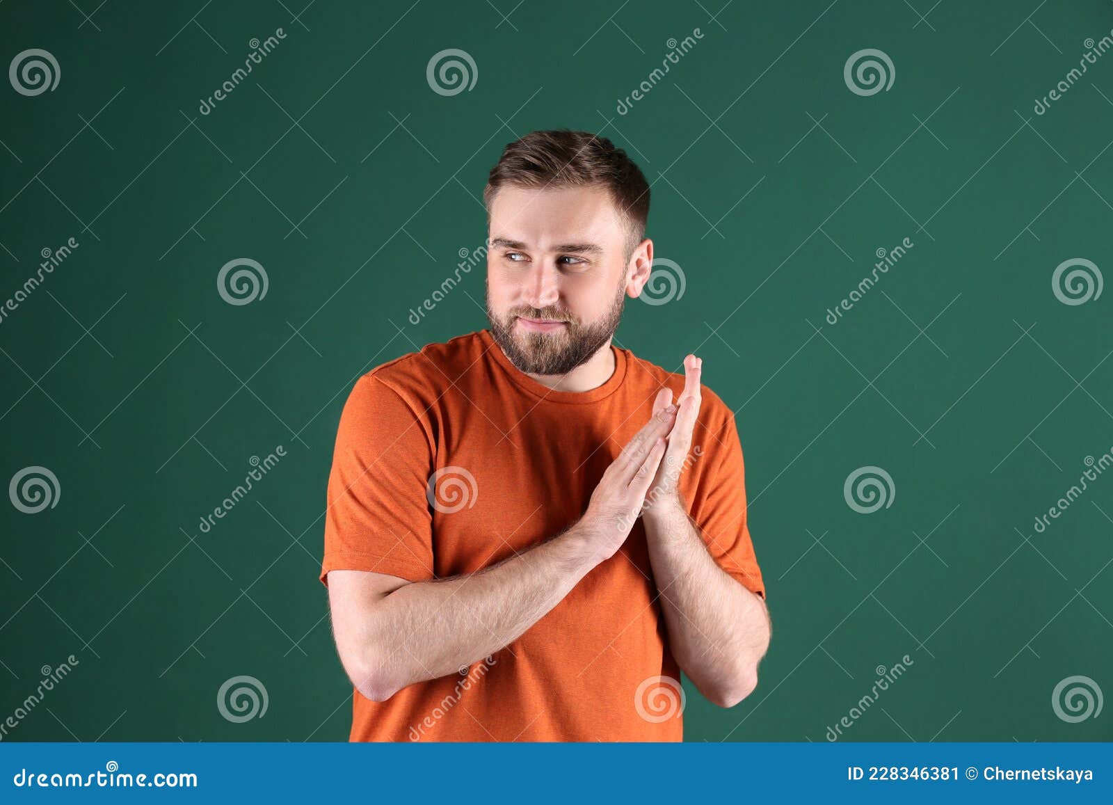 Greedy Young Man Rubbing Hands on Green Background Stock Image - Image ...