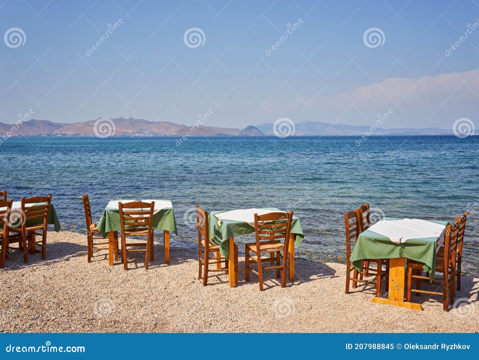 Greek Beach with Traditional Blue Tables and Chairs Stock Image - Image ...