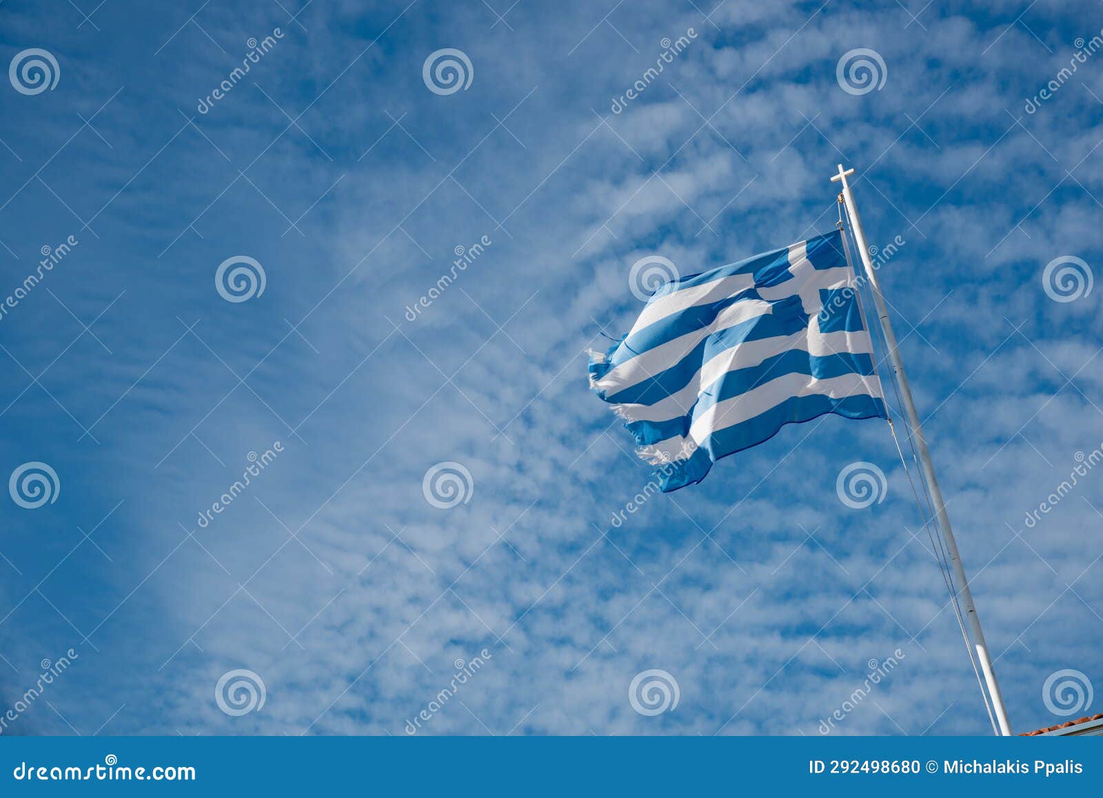 Greek Blue and White Flag Waving Against a Blue Dramatic Cloudy Sky ...