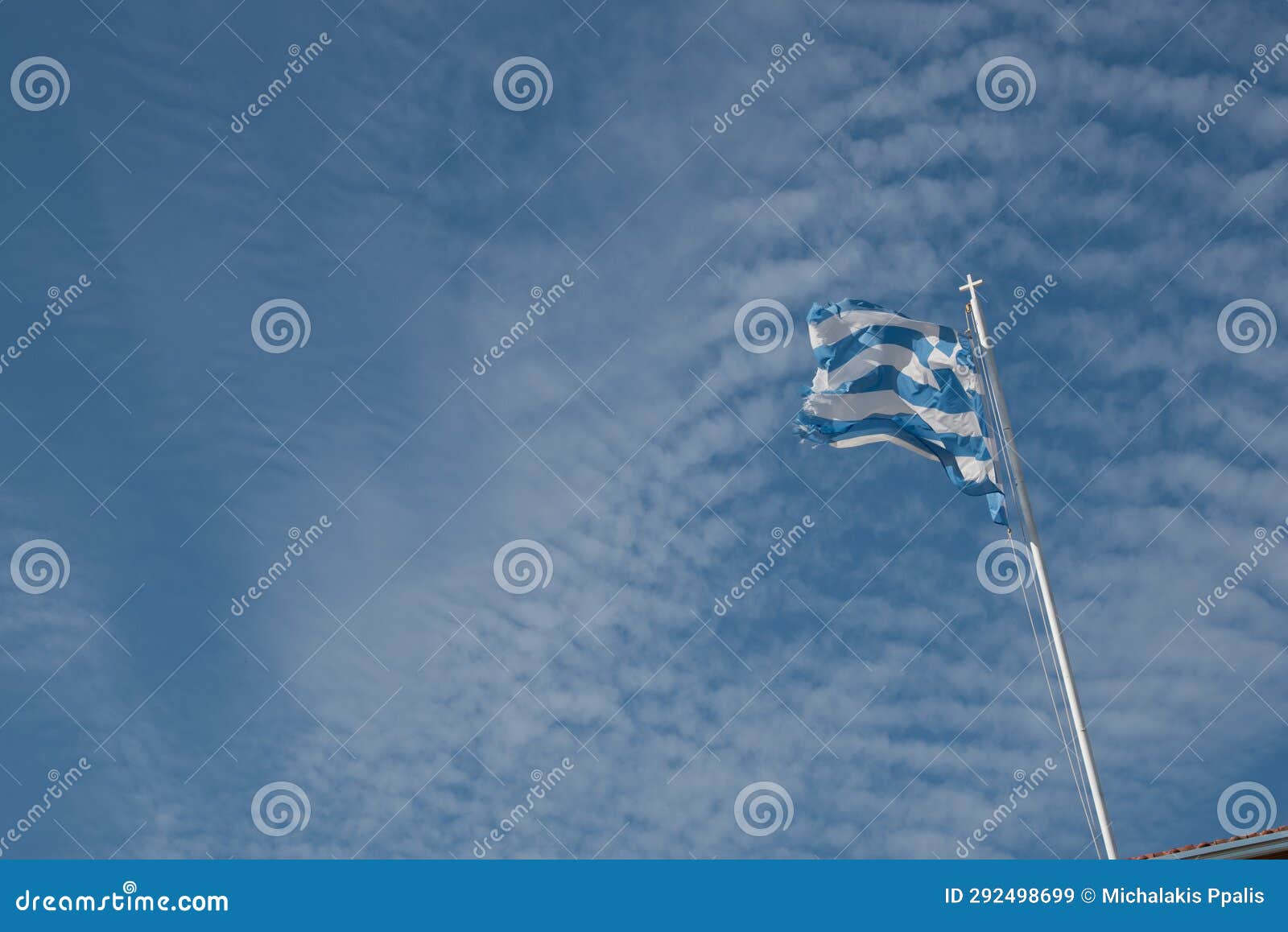 Greek Blue and White Flag Waving Against a Blue Dramatic Cloudy Sky ...