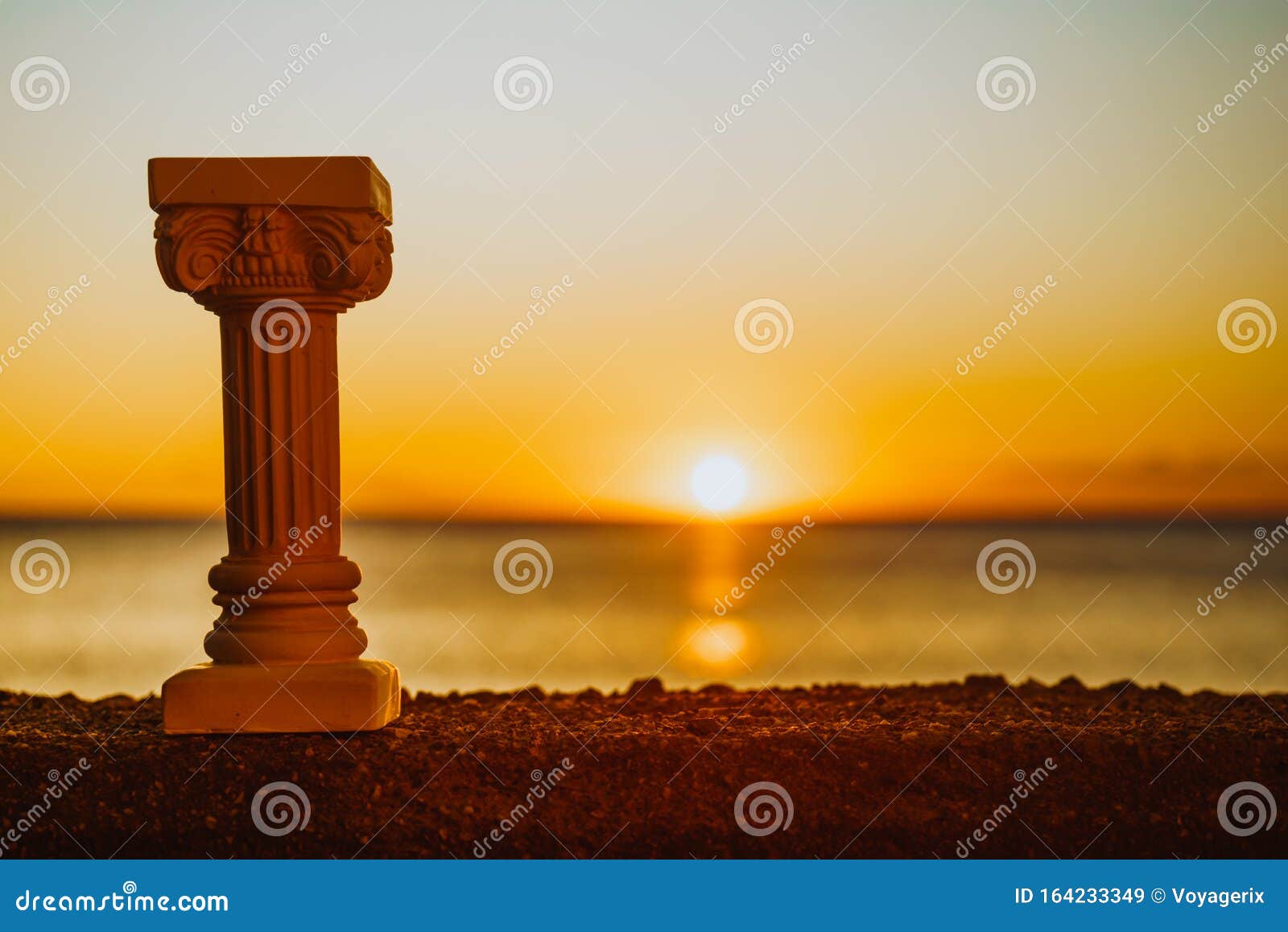 Greek Column on Shore and Sunset Over Sea Surface Stock Image - Image ...