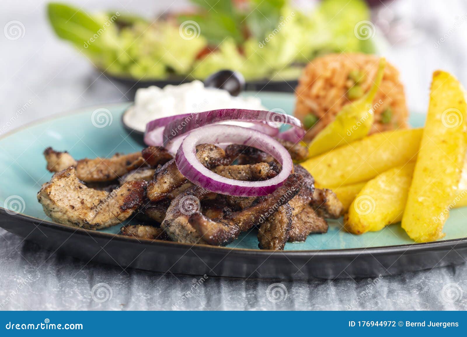 Greek gyros on a plate stock photo. Image of gyros, ricem - 176944972