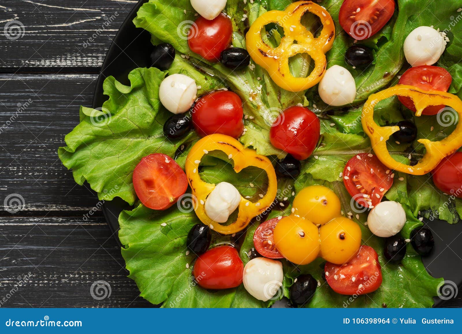 Greek Salad in a Black Plate Close-up on a Rustic Background ...