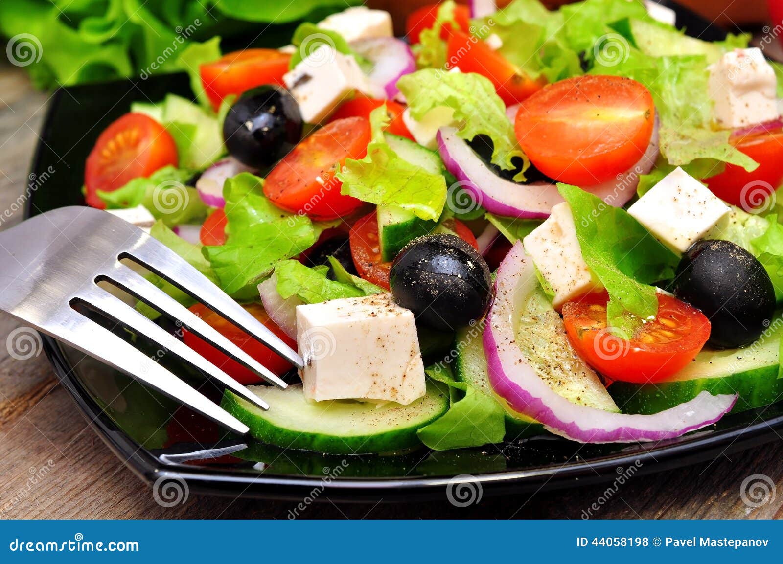 Greek salad and fork stock photo. Image of lean, feta - 44058198