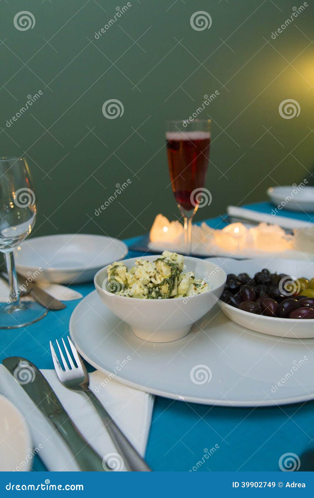 Greek Style Table Arrangement With A Plate Filled With Different Types ...