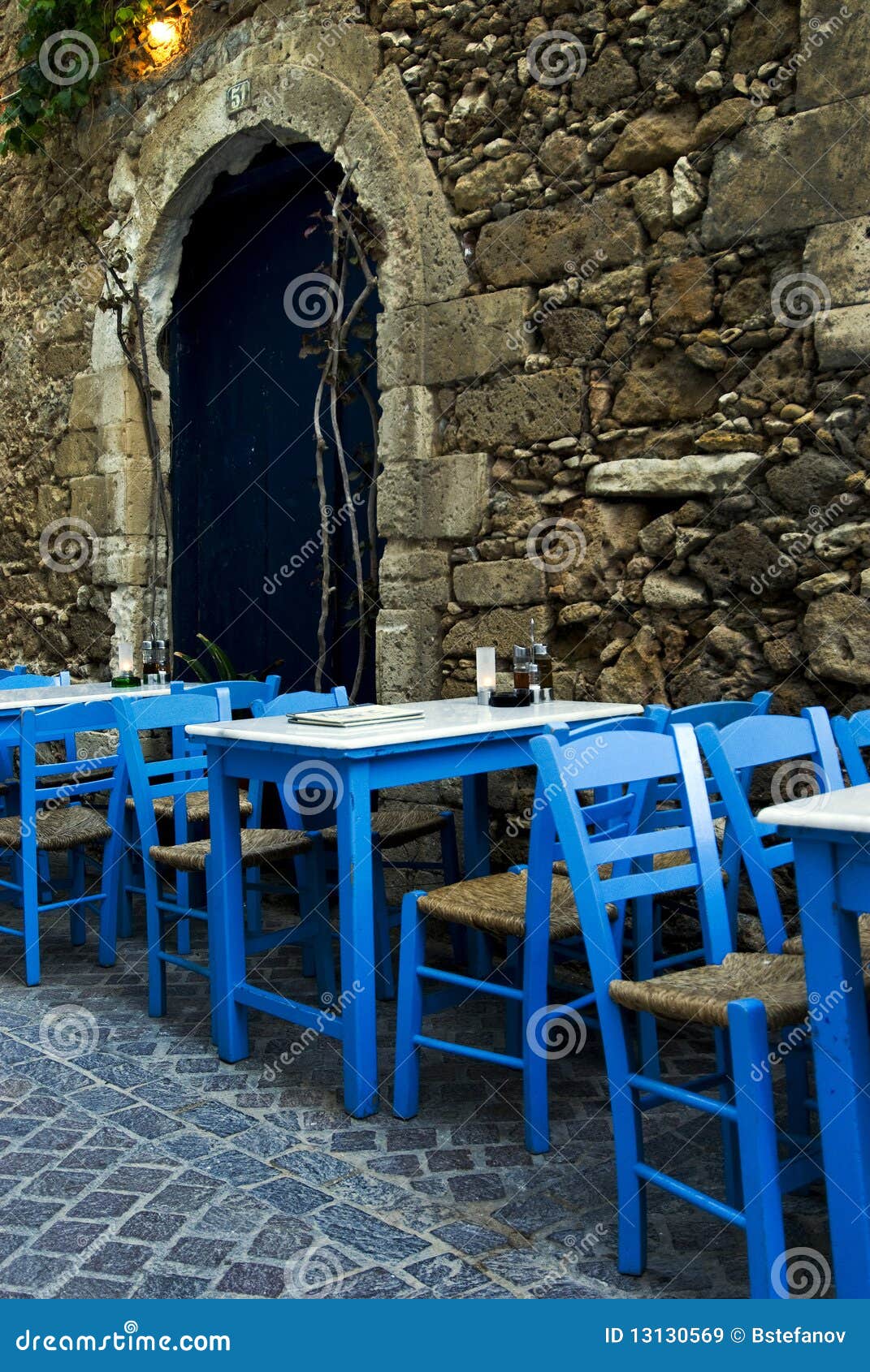 Greek tables and chairs. stock image. Image of stone - 13130569