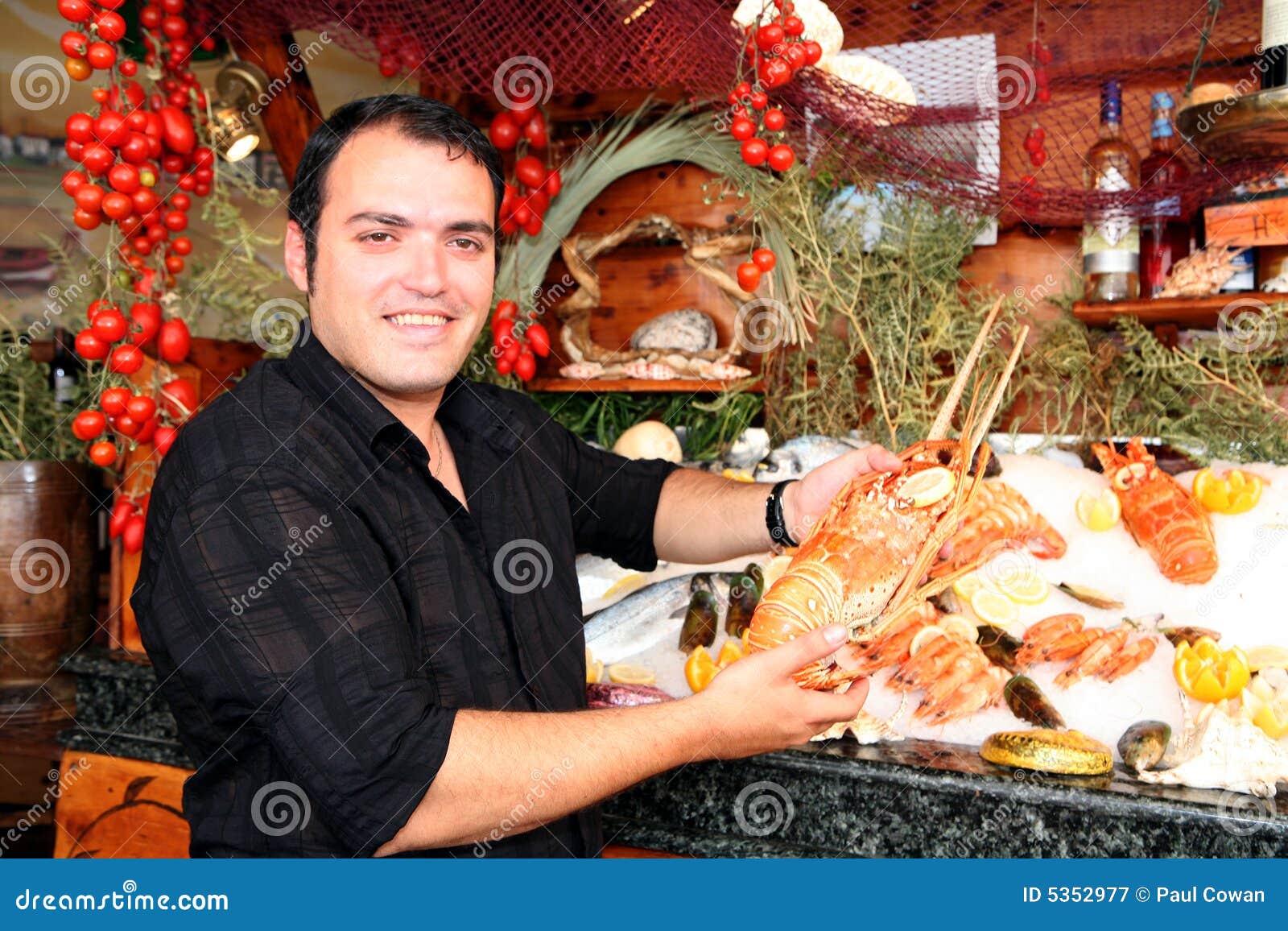 Greek waiter with lobster stock image. Image of taverna - 5352977