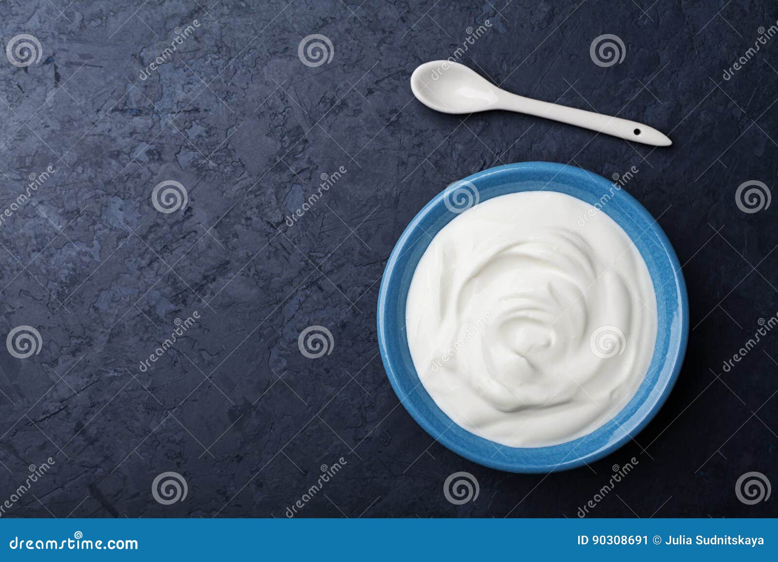 Greek Yogurt in Blue Bowl on Black Table Top View. Stock Image - Image ...