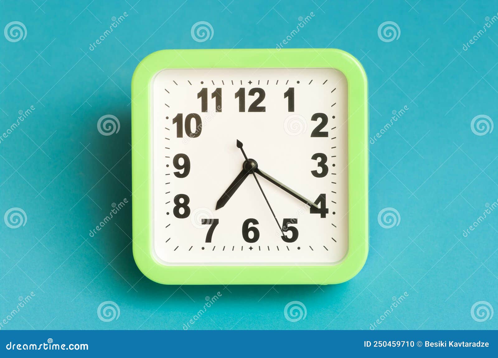Green Analog Clock on Blue Background Stock Photo - Image of minute ...