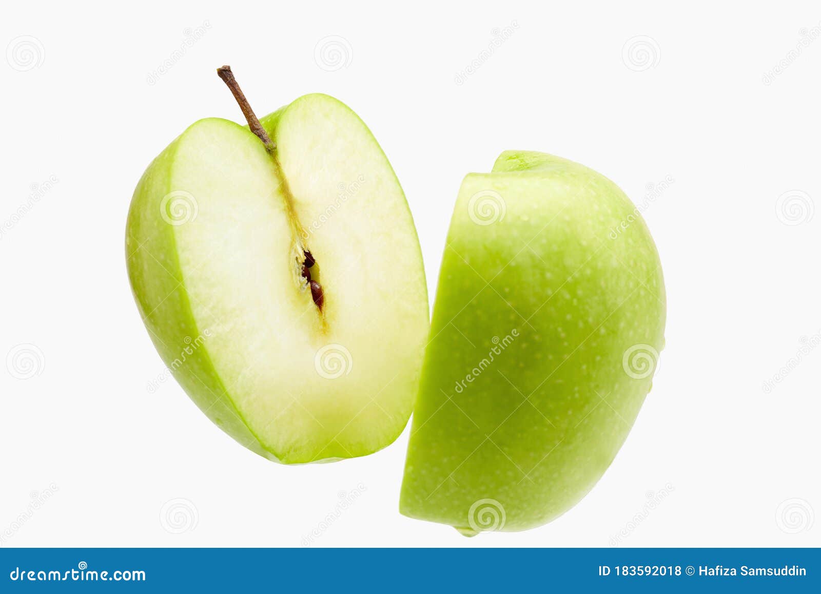 Green apple cut in half stock photo. Image of shot, drink - 183592018