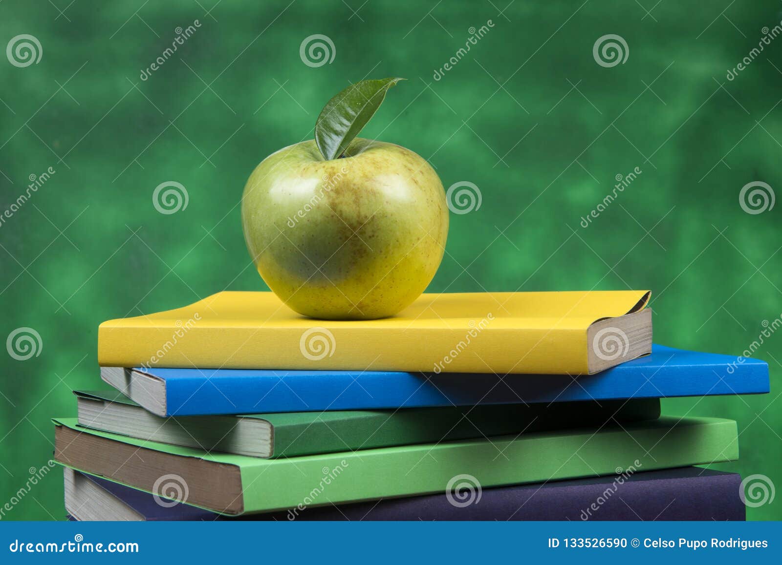 Apple Fruit on Top of a Book Stack, on the Back of School Classes Stock ...