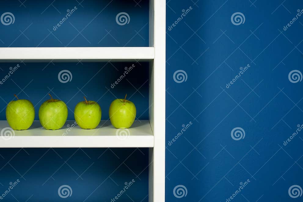 Green Apple Inside White Bookcase Stock Image - Image of object, basic ...