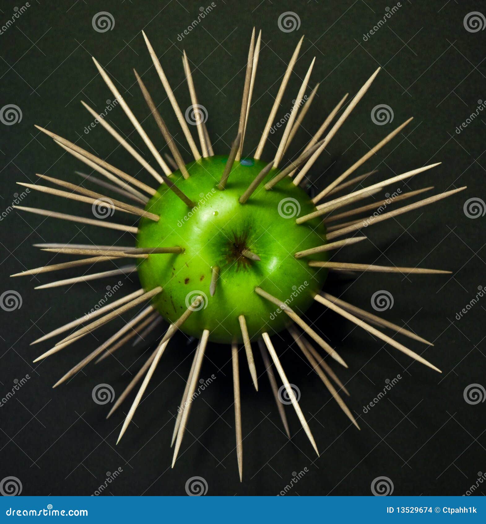 Green Apple in Toothpicks Isolated on Black Stock Photo - Image of ...