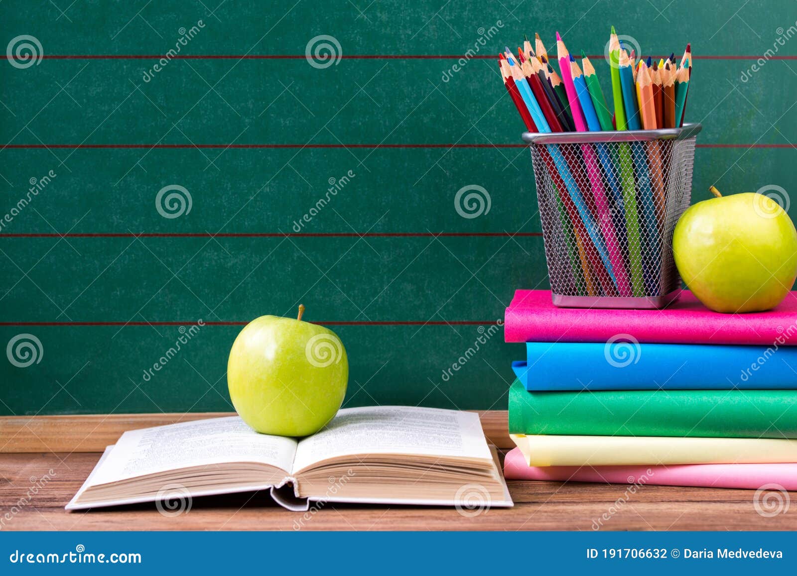 Green Apple, Coloured Books and Pencils on the Chalkboard Background ...
