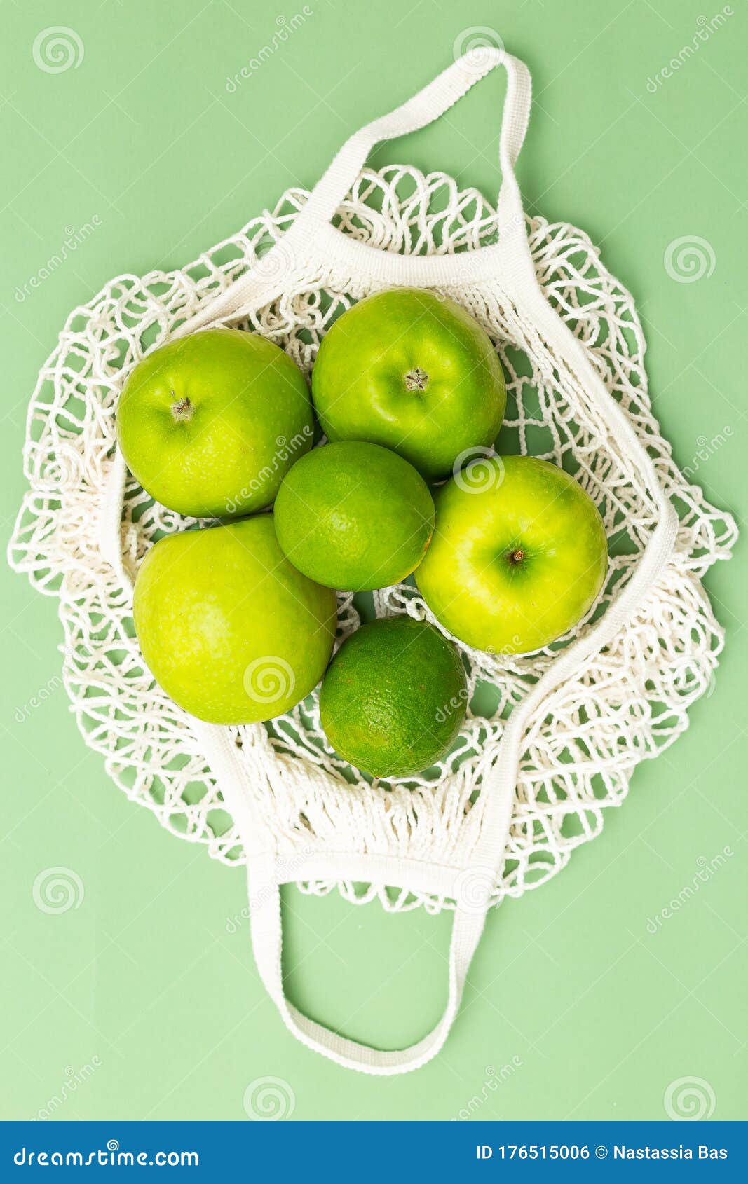 Green Apples in a Net Bag on a Green Background. Green Monochrome ...