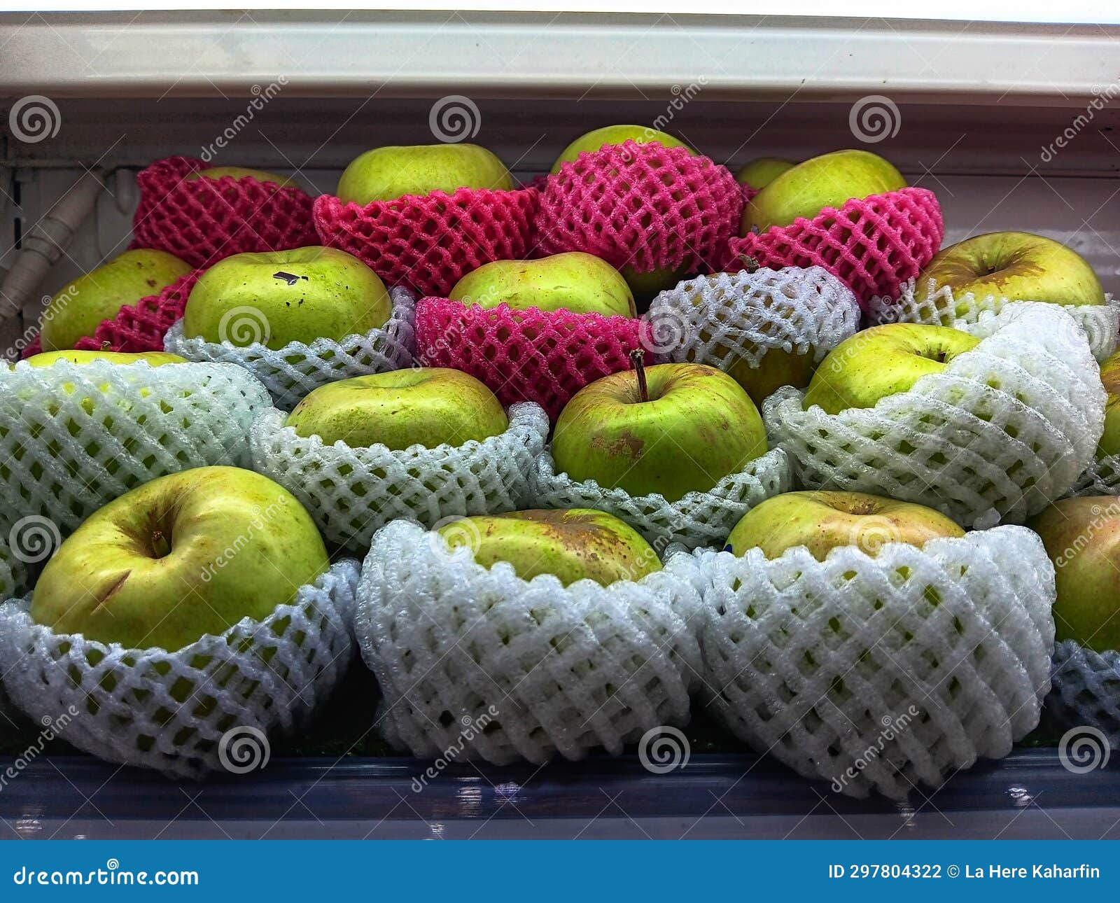 Green Apples Wrapped in Net Foam Stock Photo - Image of color ...