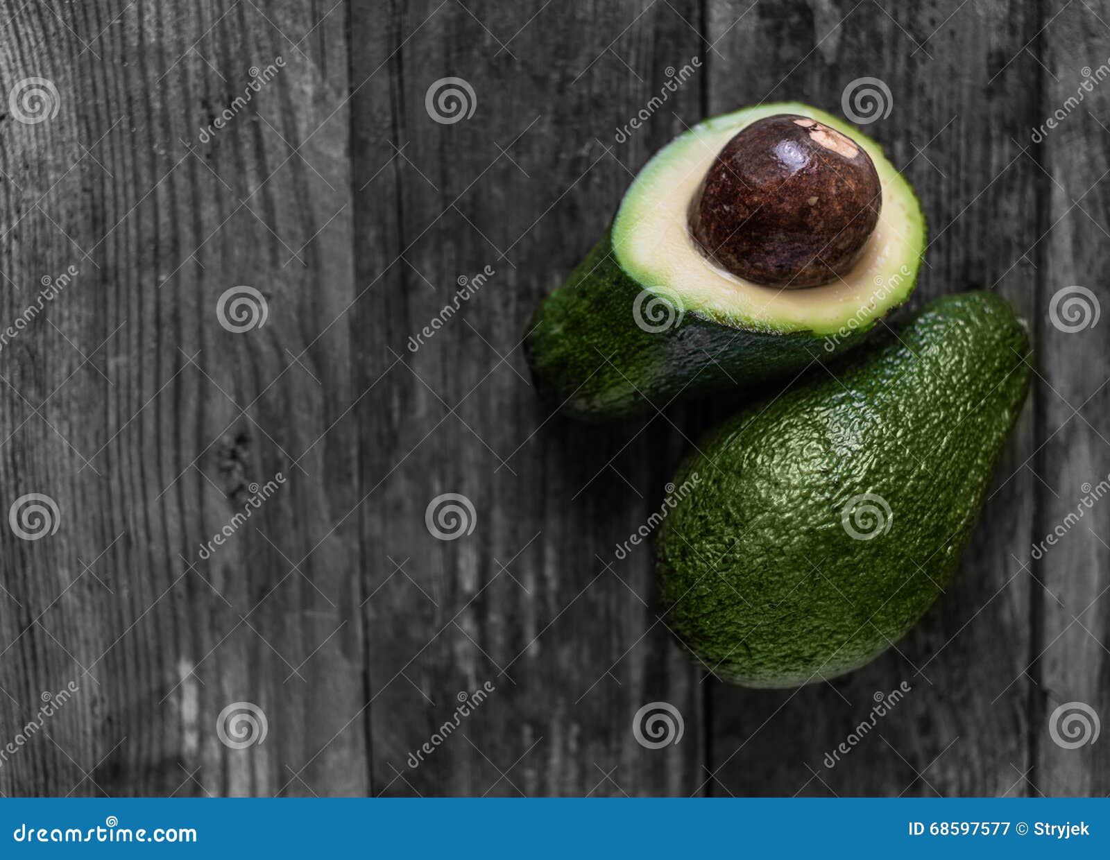 Green Avocados on Wood Table Stock Image - Image of closeup, food: 68597577
