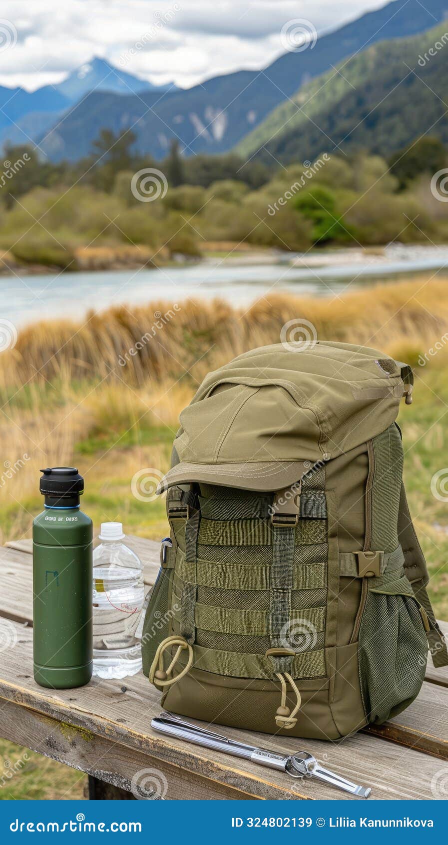 A Green Backpack and a White Hard Hat Sit on a Wooden Table in Front of ...