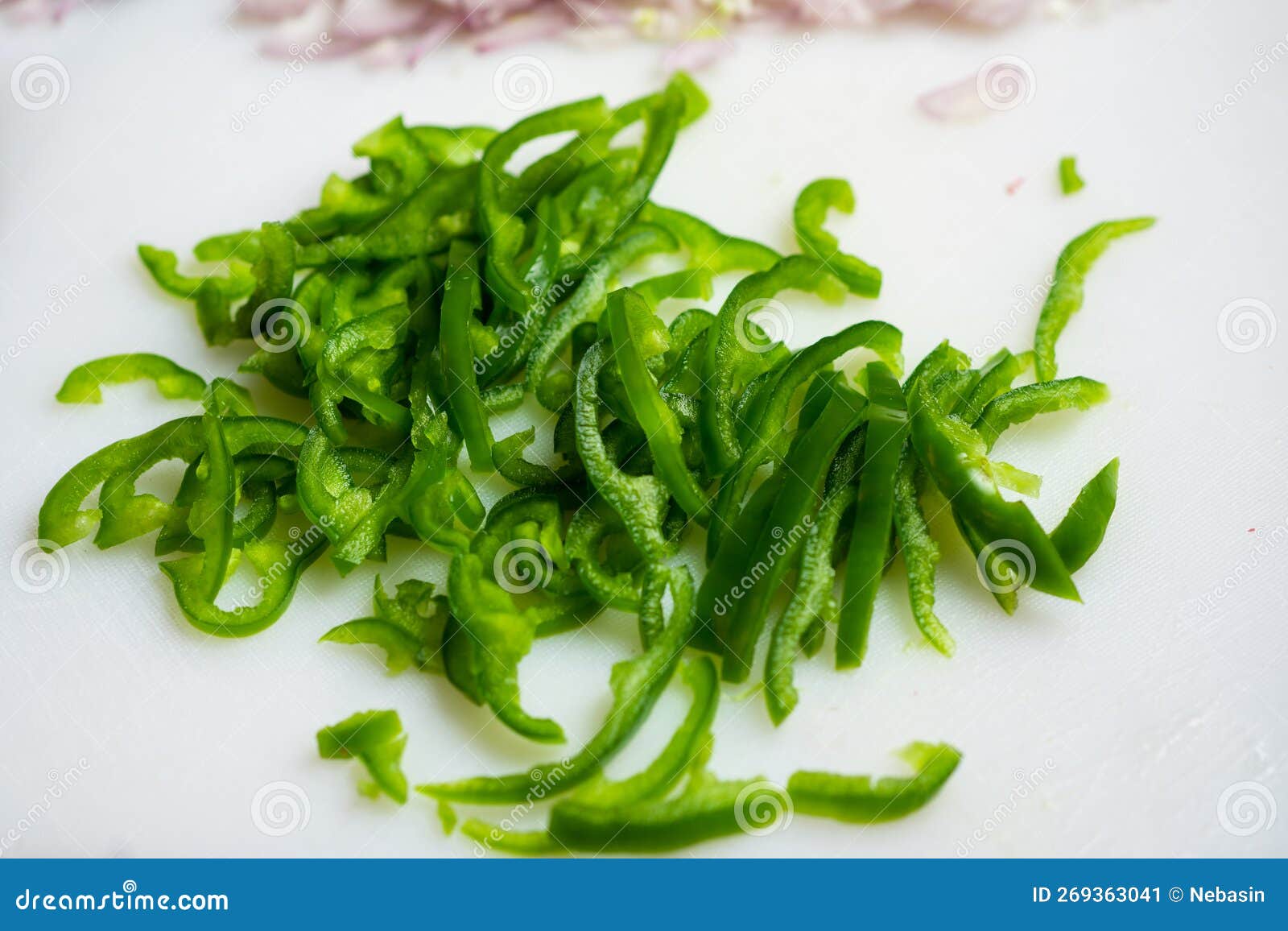 Green Bell Pepper Cut To Length on a White Cutting Board Stock Image ...