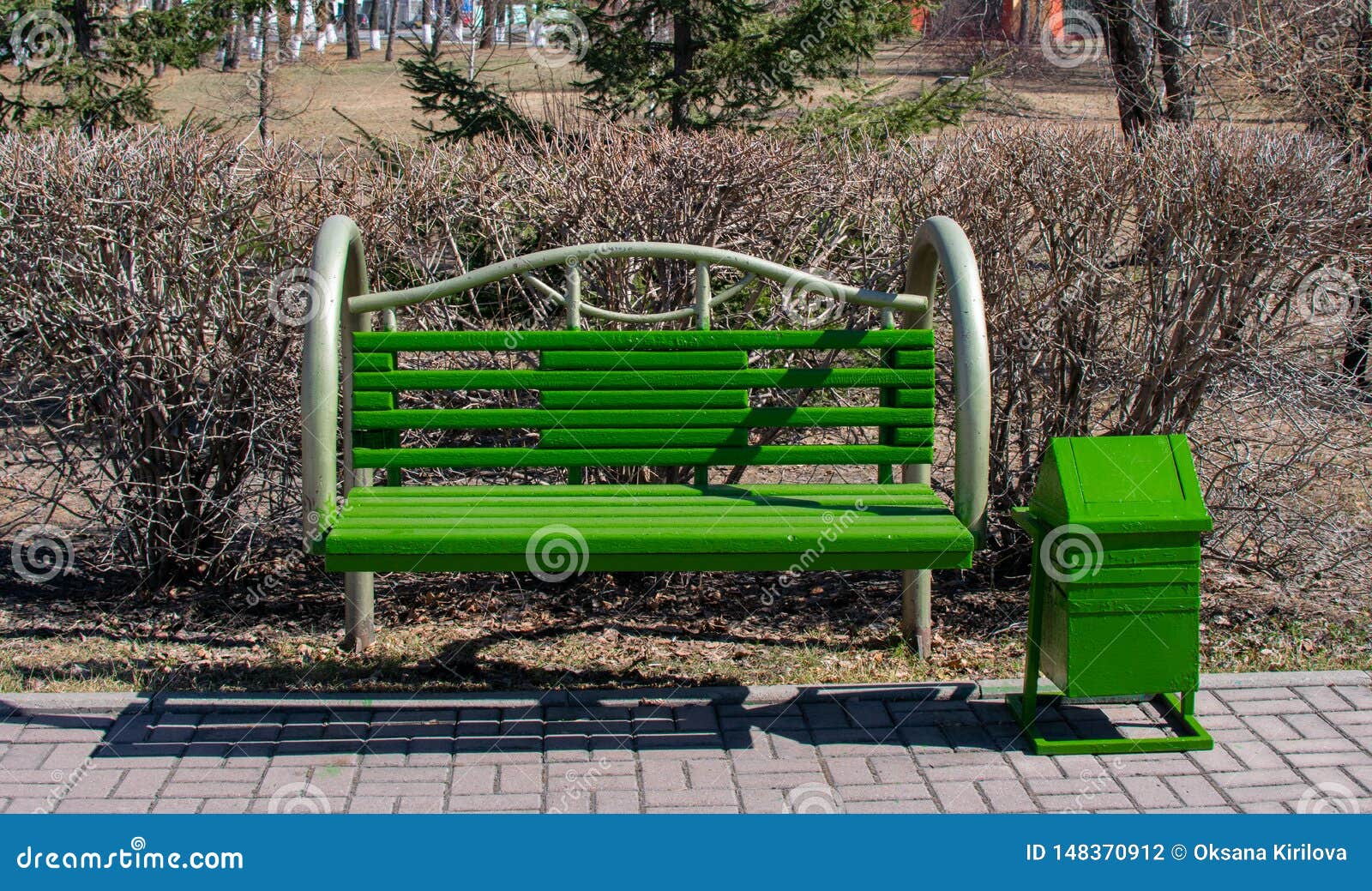 Green bench in the park stock photo. Image of person - 148370912