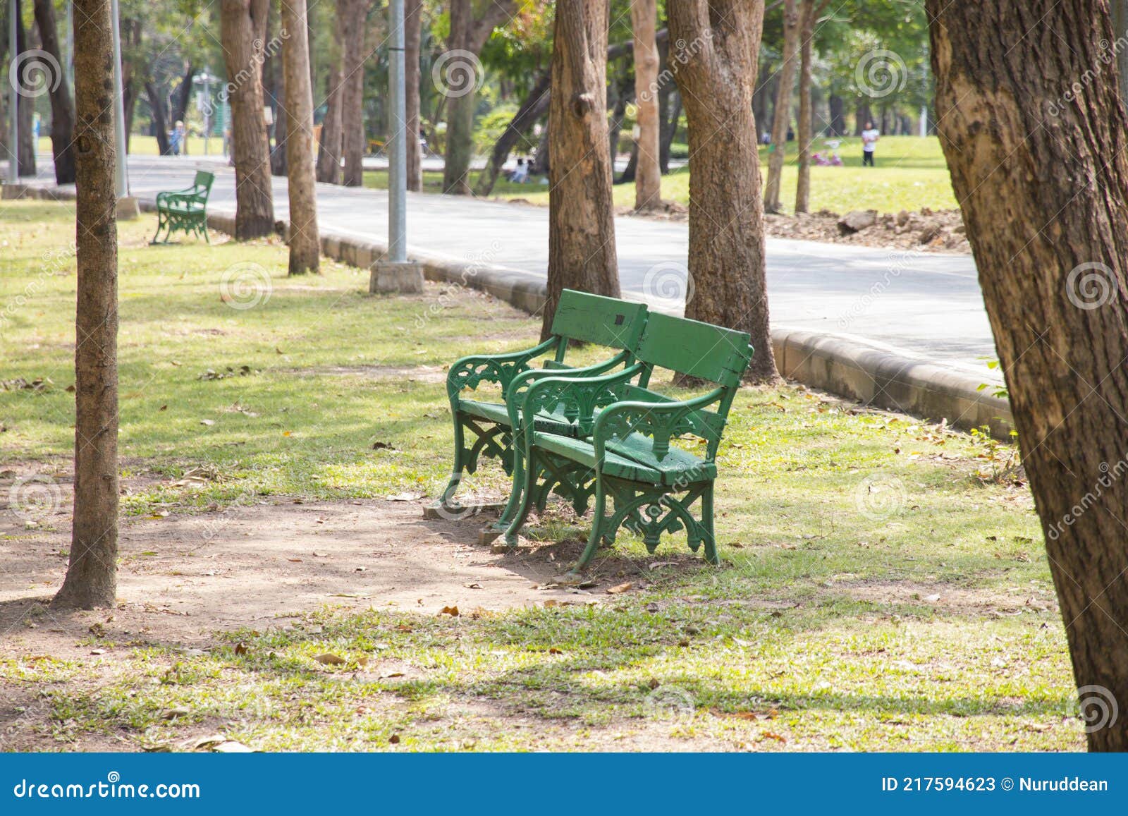 Green Benches beside Walkway in the Park Stock Image - Image of land ...