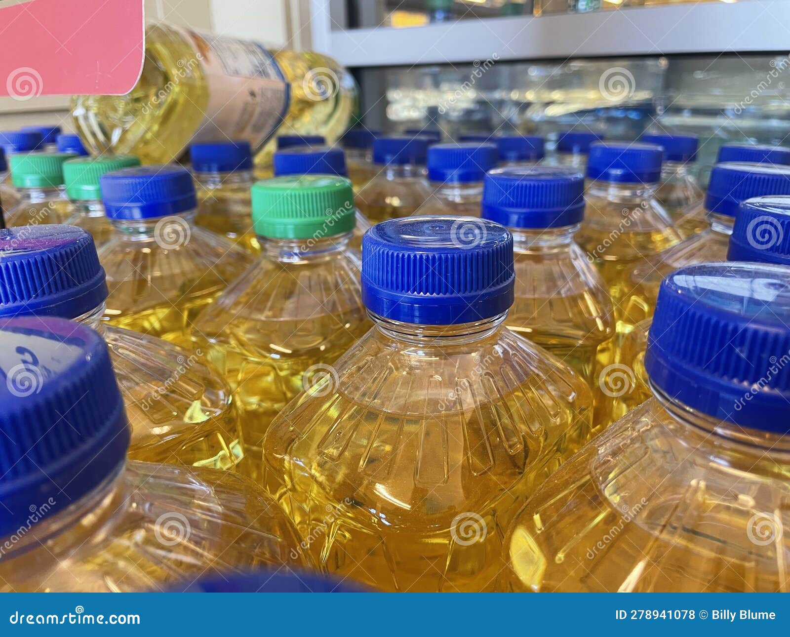 Green and Blue Cooking Oil Bottle Tops Rows and Window Stock Photo ...