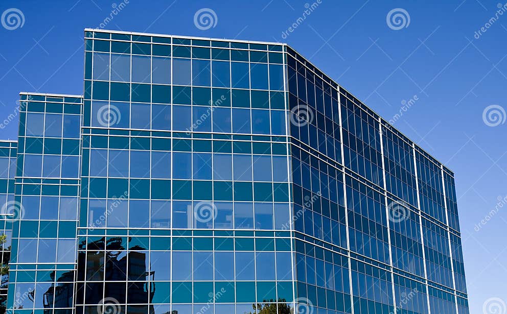 Green and Blue Striped Building on Blue Stock Photo - Image of glass ...