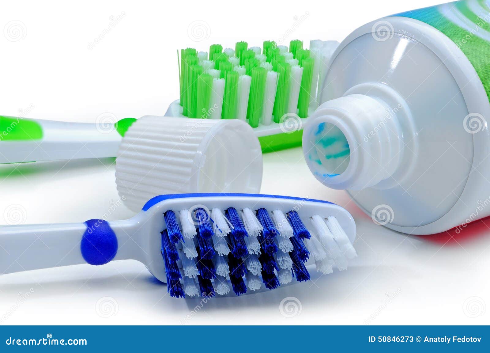 Green, Blue Toothbrushes and Toothpaste Isolated on a White Back Stock ...