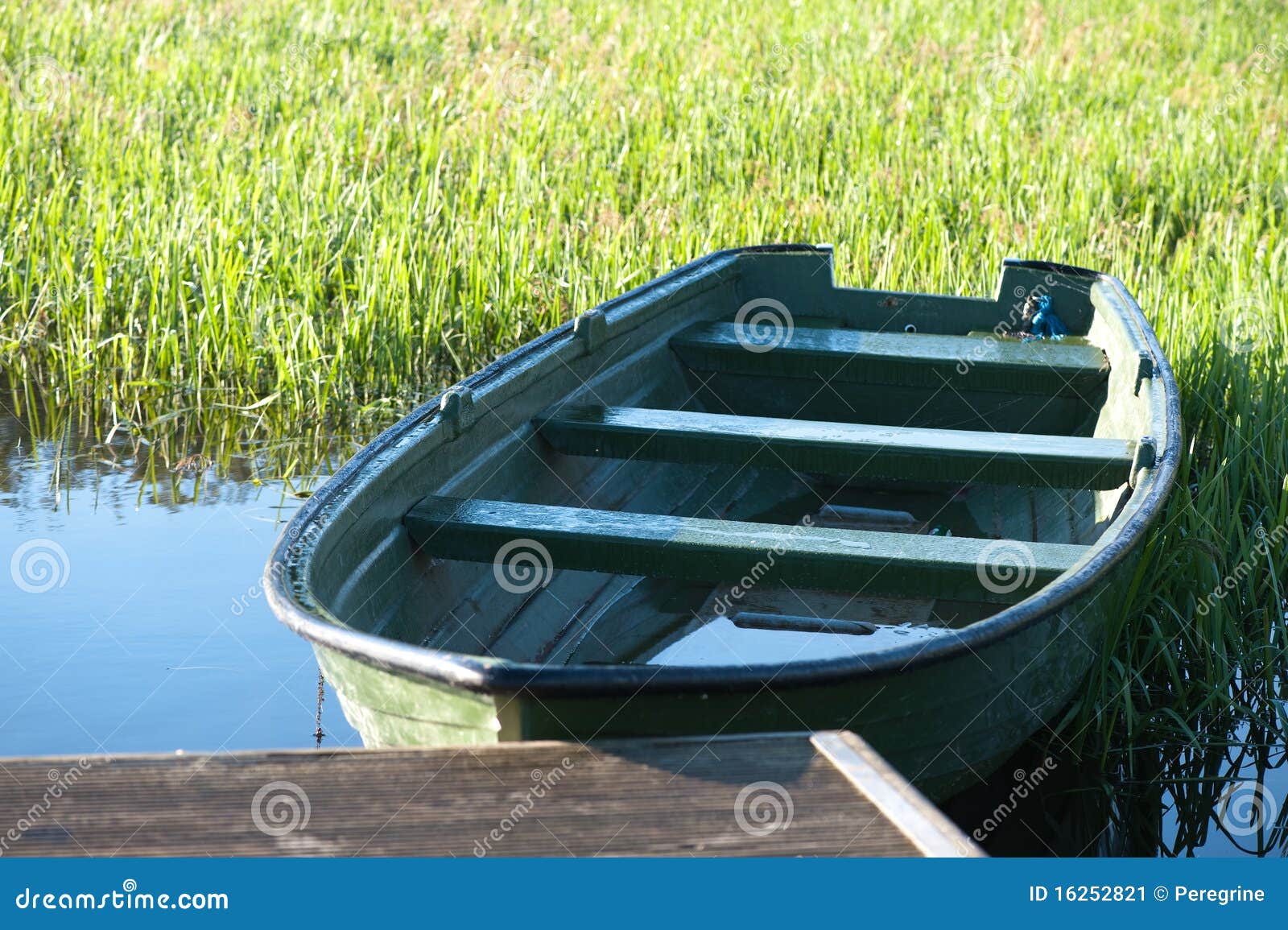 Green boat stock image. Image of blue, riverbank, grass - 16252821