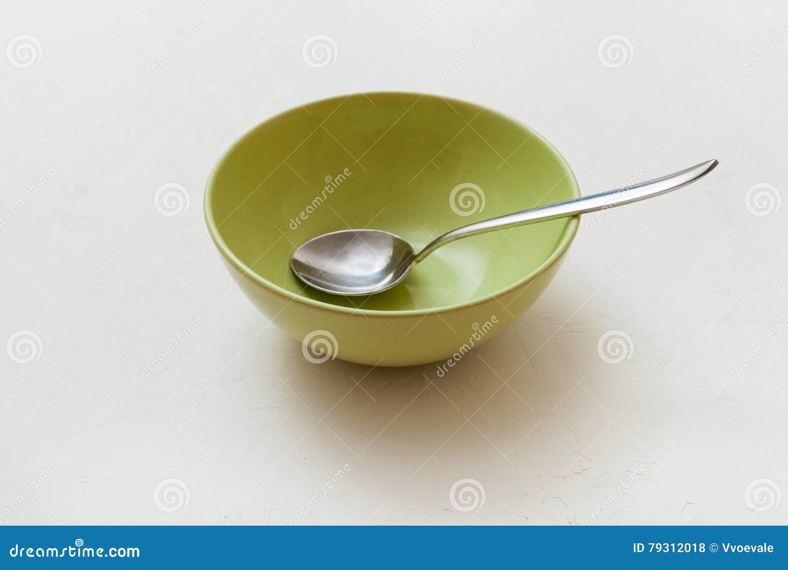Green Bowl with Spoon on White Plaster Stock Photo - Image of empty ...