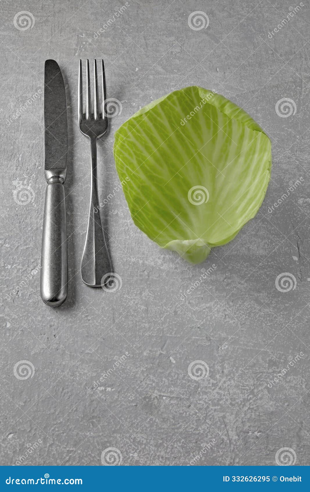 Green Cabbage Leaf and Fork with Knife on Grey Concrete Table Stock ...
