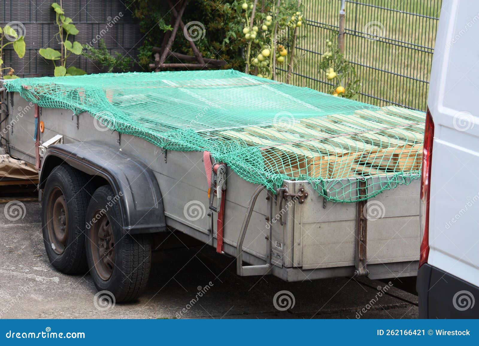 Green cargo trailer net stock image. Image of shipment - 262166421