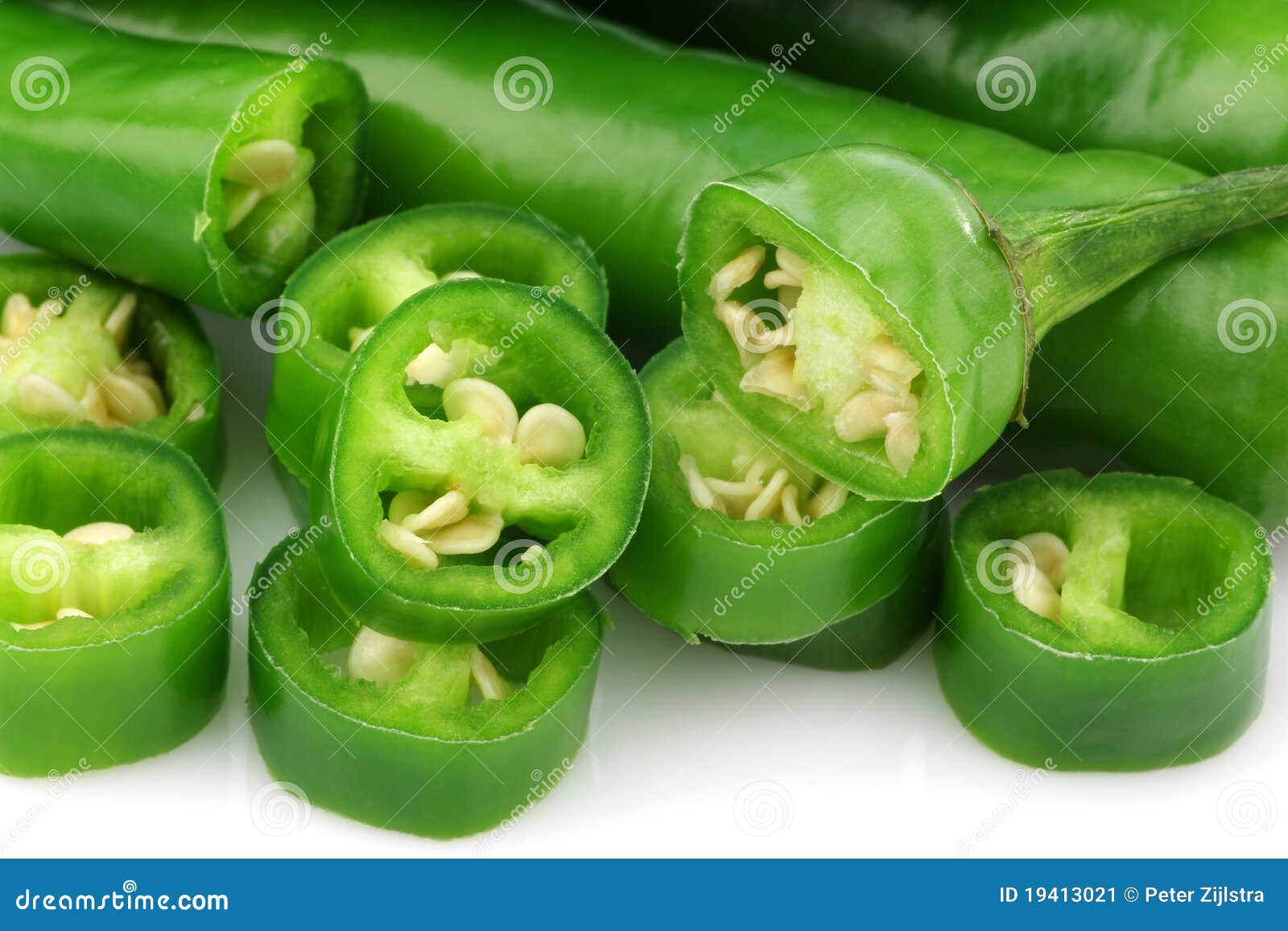 Green Chili Peppers and Cut Pieces Stock Image - Image of close ...