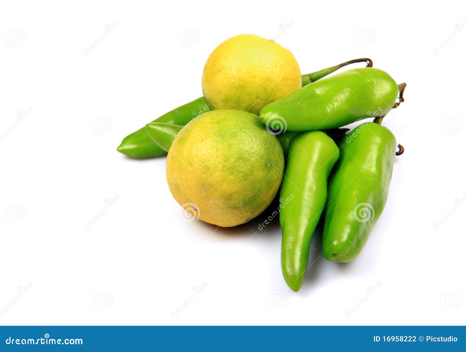 Green Chillies And Ripe Lemons Are On A White Background. Lemon Is Used ...