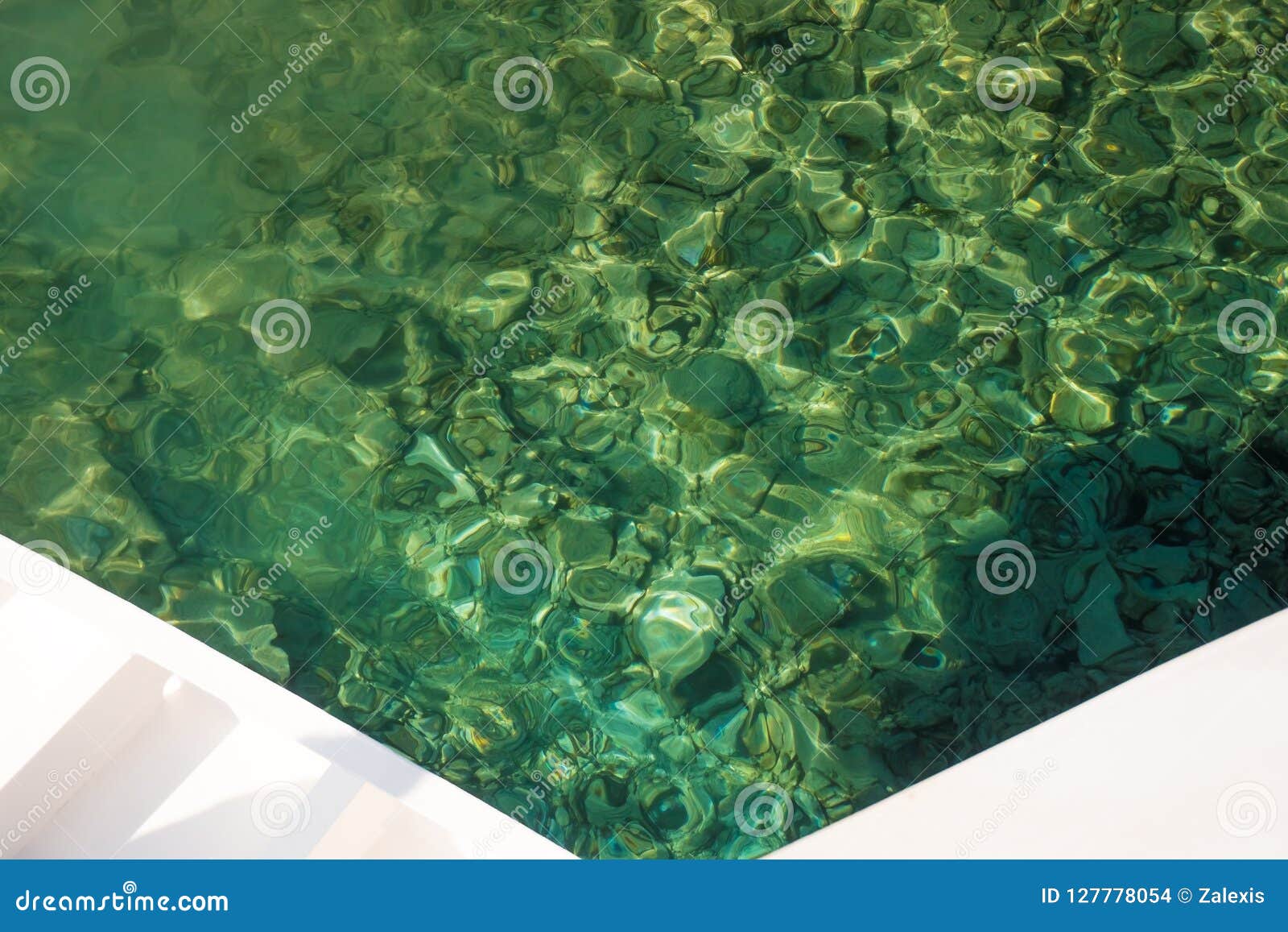 Green, Clear Ocean Water with Rocks at the Bottom Captured in V Stock ...
