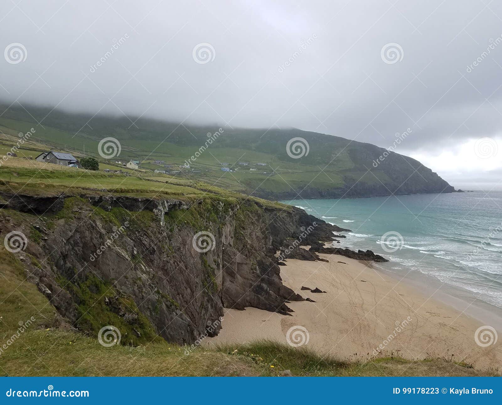 Green coast stock image. Image of cloudy, green, rock - 99178223