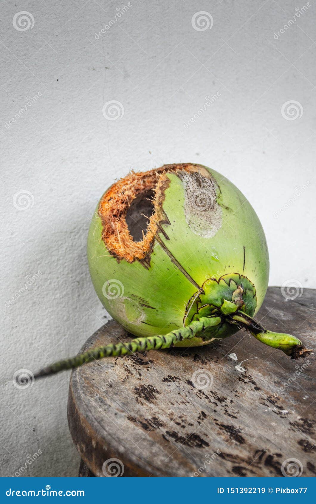 Green Coconut with Hole on Table Stock Image - Image of drink, damage ...